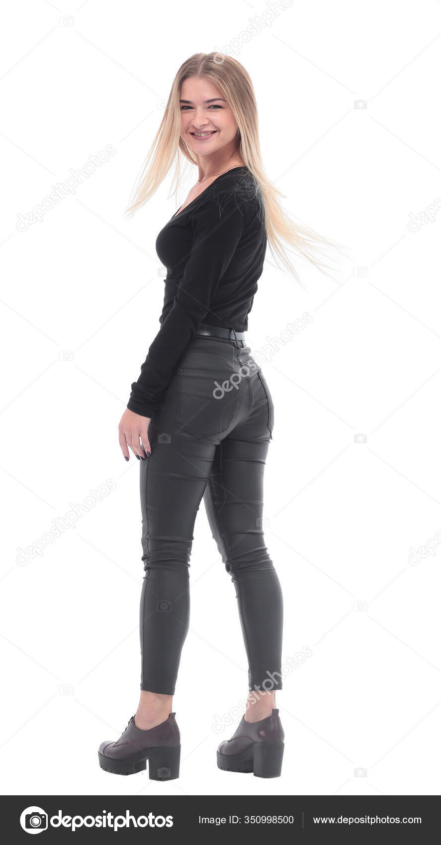Rear view. smiling young woman looking at the camera — Stock Photo ...