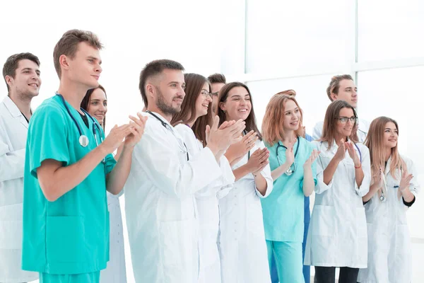 top view. a group of smiling doctors pointing at you. - Stock Image ...