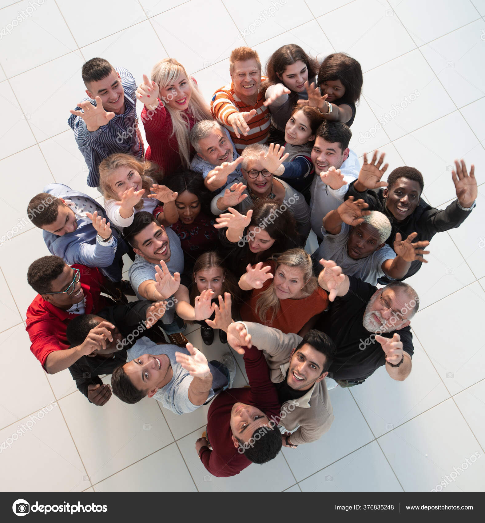 Multiethnic group of people standing together with hands up — Stock ... Multiethnic group of people standing together with hands up — Stock ...