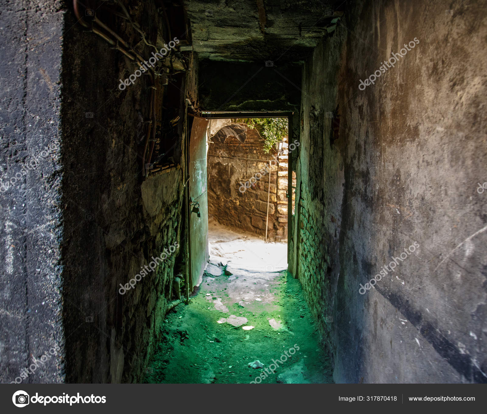 Old abandoned tunnel in the slum underground cellar. Entrance to urban ...