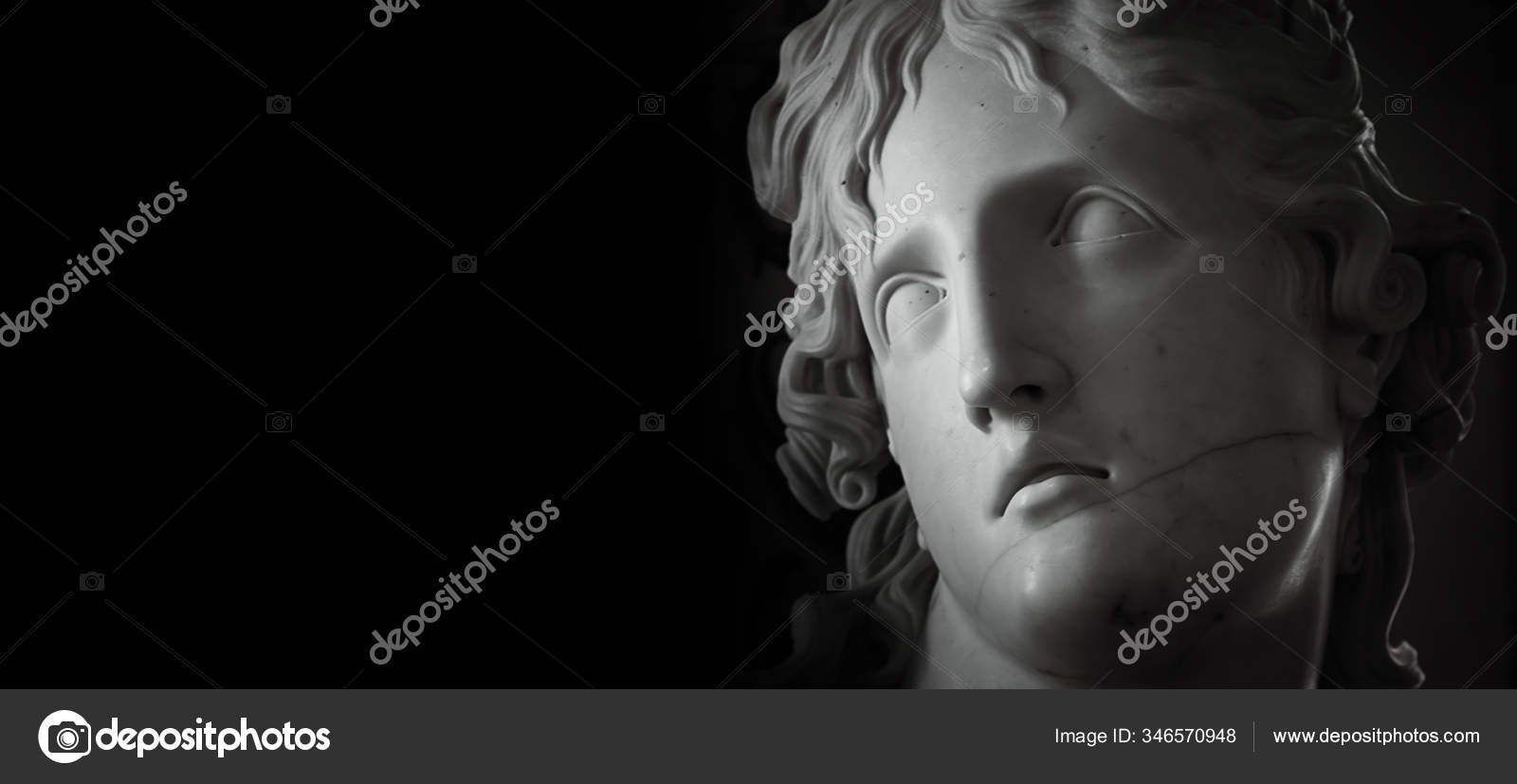 White plaster bust portrait sculpture against a dark background with ...