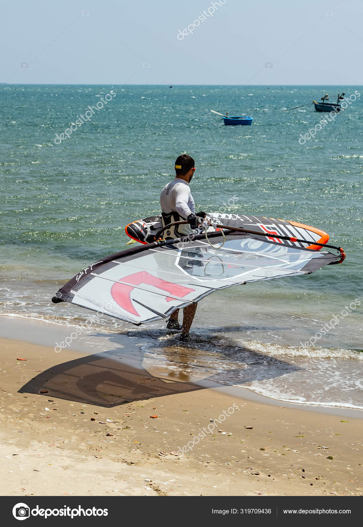 Windsurfer Surfing The Wind On Waves. Mui Ne Coco Beach. Vietnam ...