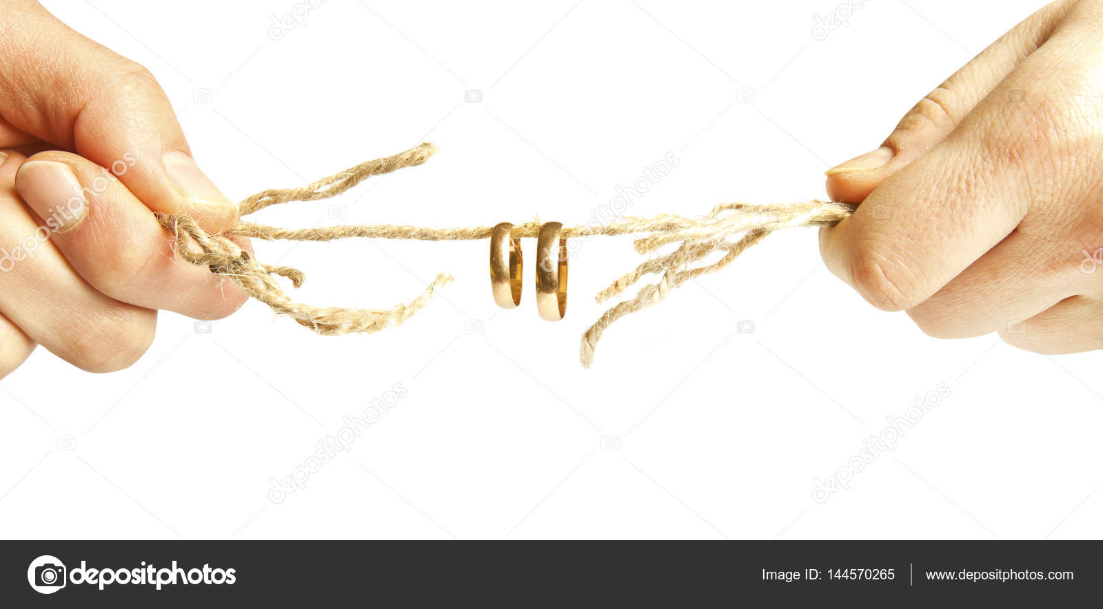 Two people pulling the rope and two golden rings — Stock Photo ...