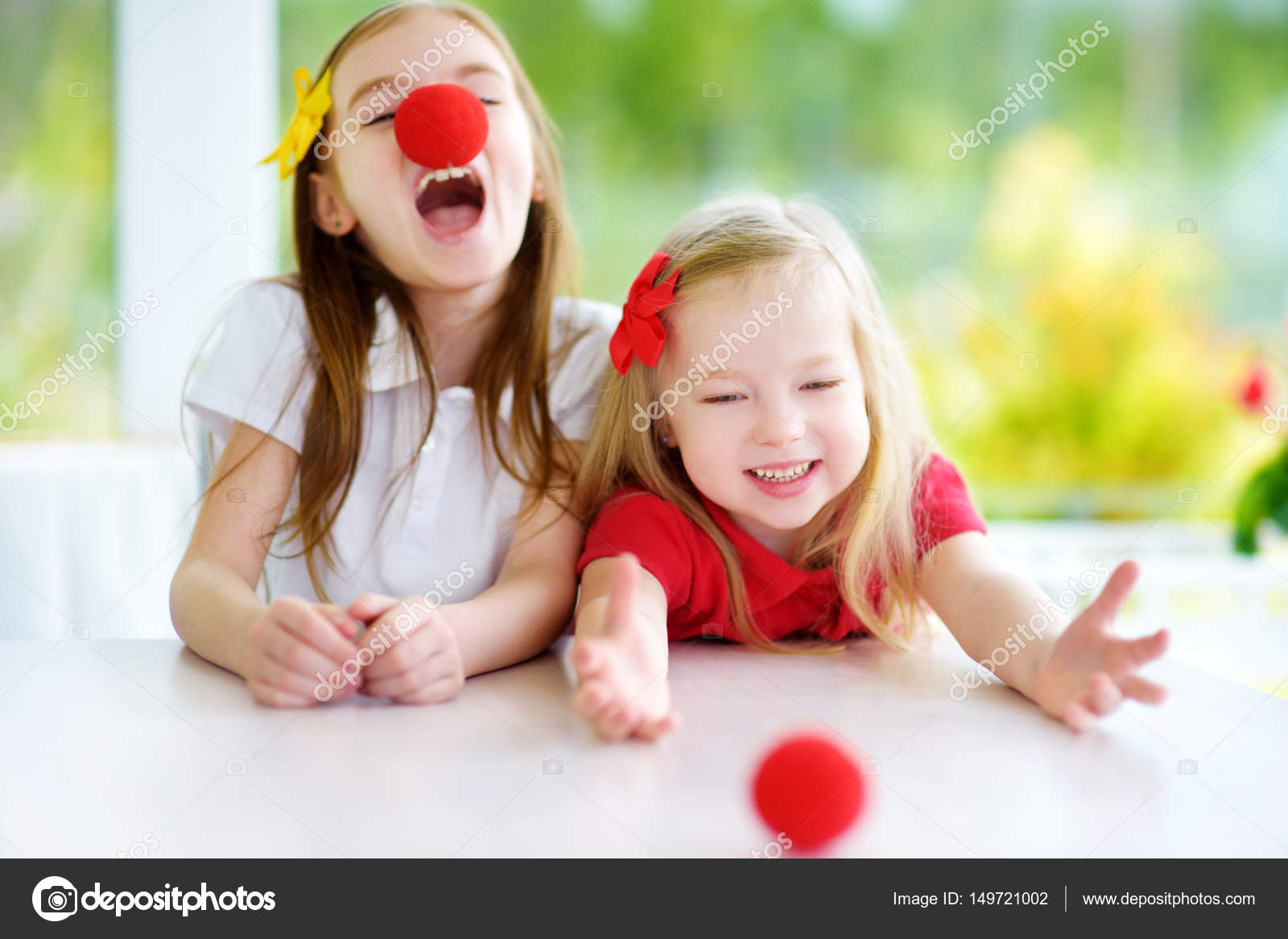 Two kids playing together Stock Photo by ©MNStudio 149721002