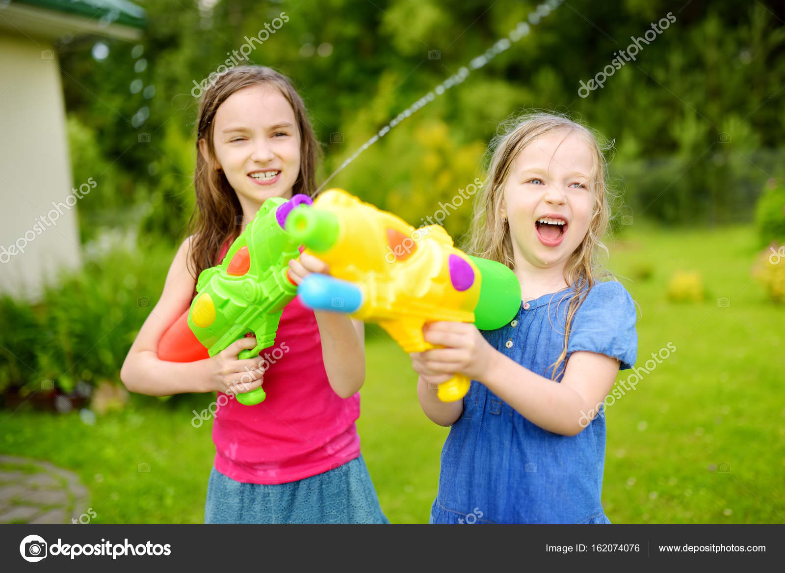 Cute children playing with water guns ⬇ Stock Photo, Image by ...