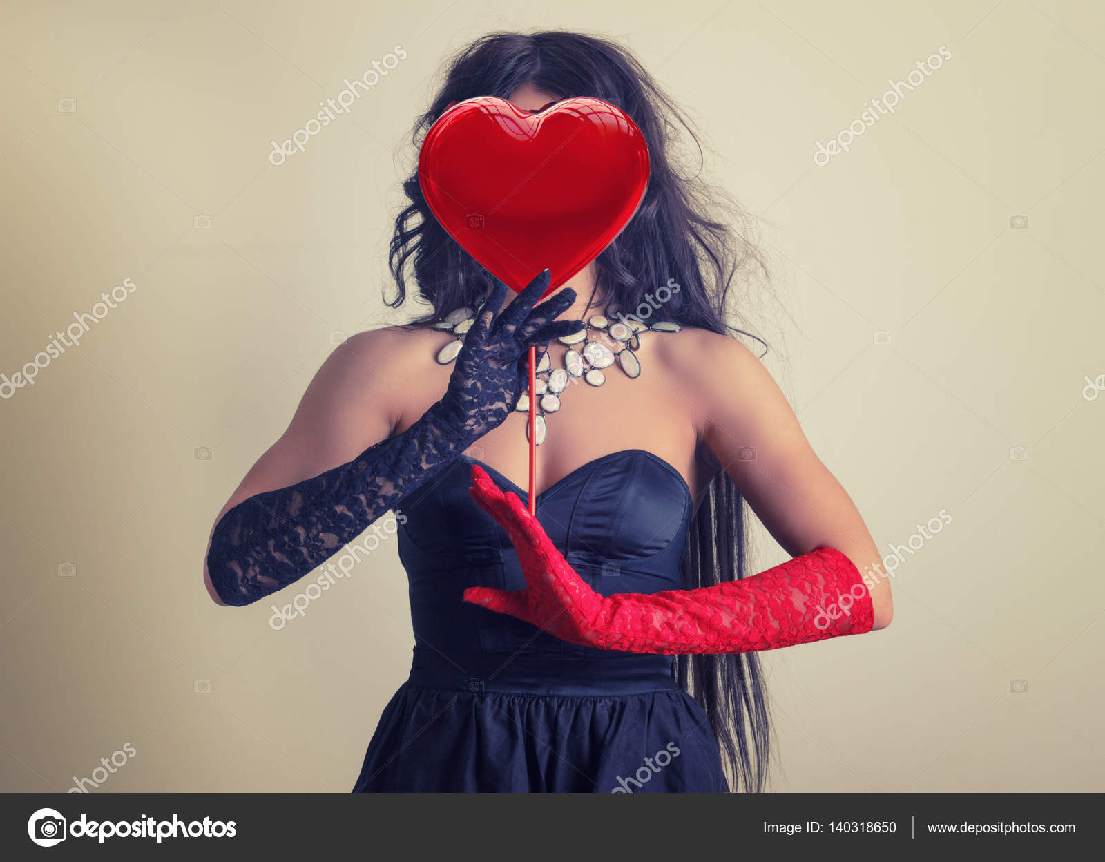 Girl red hearts covers his face. — Stock Photo © papa42 #140318650