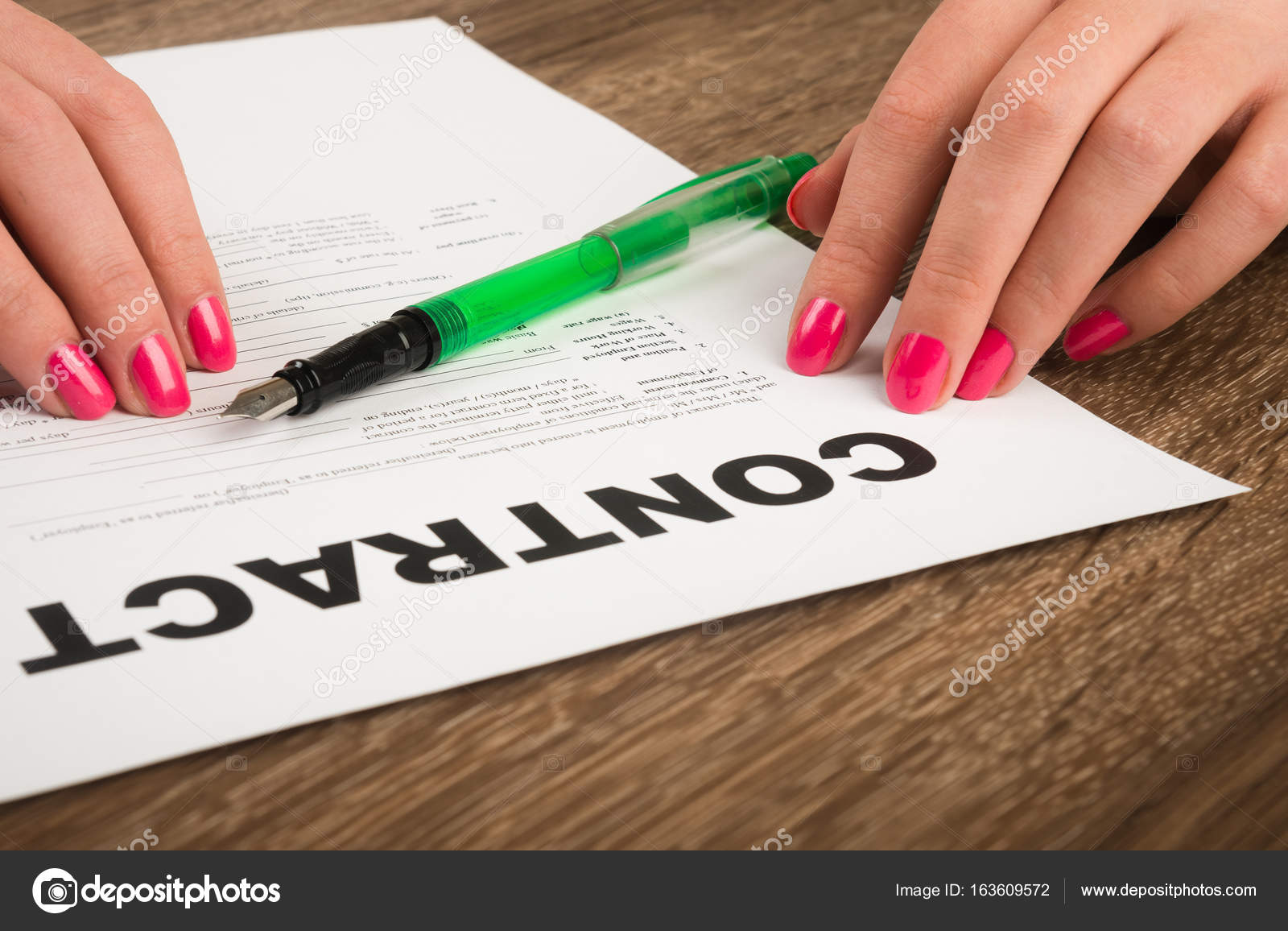 Hands with pen signing contract Stock Photo by ©valphoto 163609572