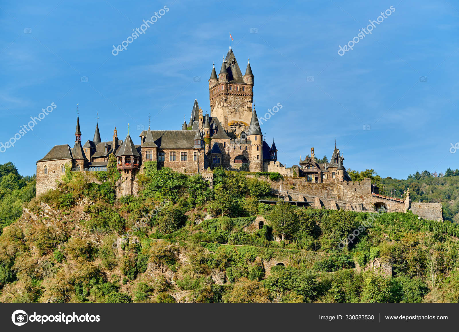 Beautiful Reichsburg castle on a hill in Cochem, Germany Stock Photo by ...