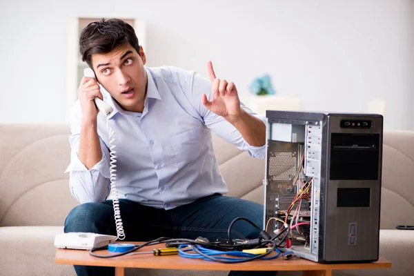 Angry customer trying to repair computer with phone support Stock Photo ...