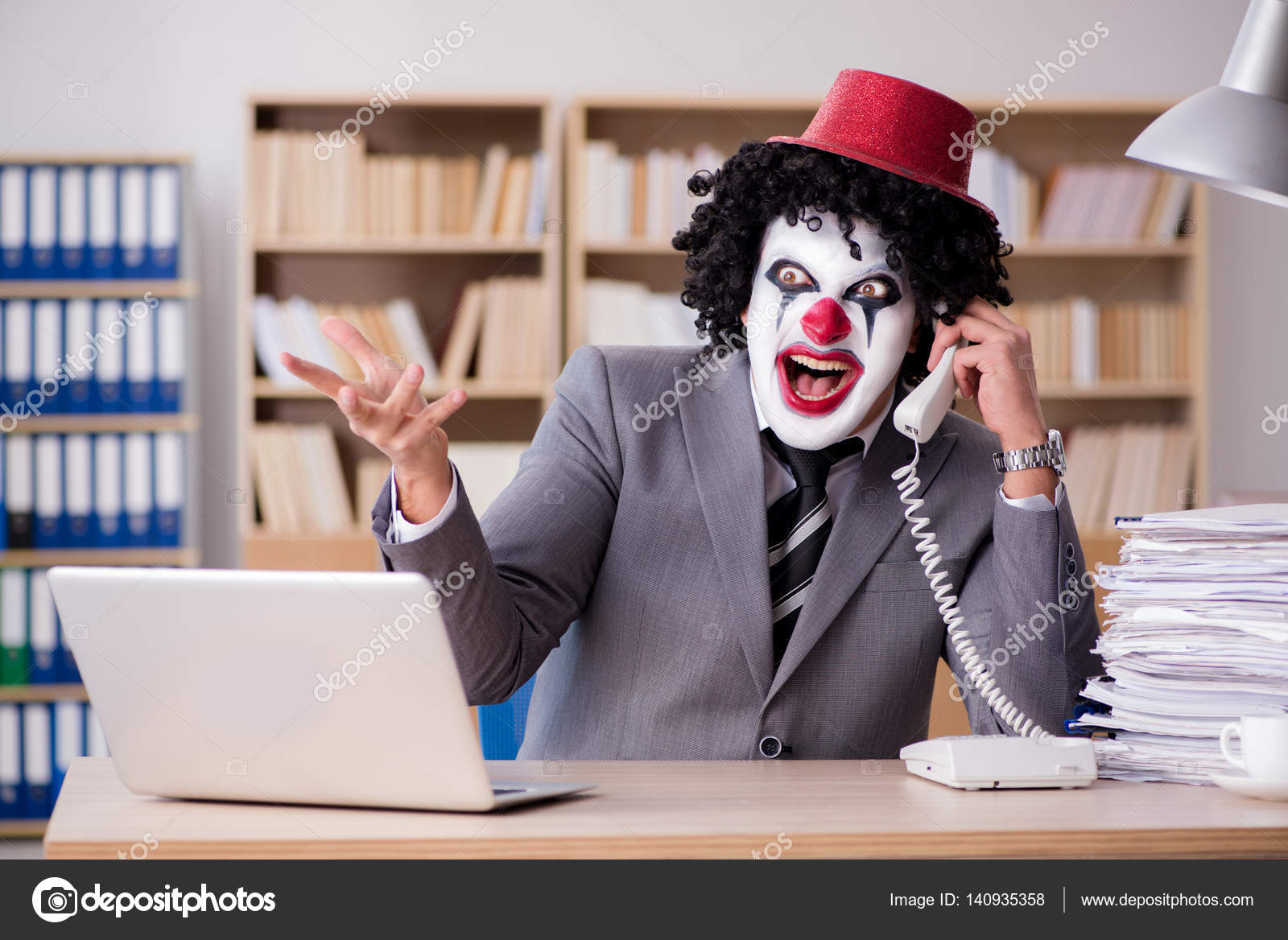 Clown businessman working in the office — Stock Photo © Elnur_ #140935358
