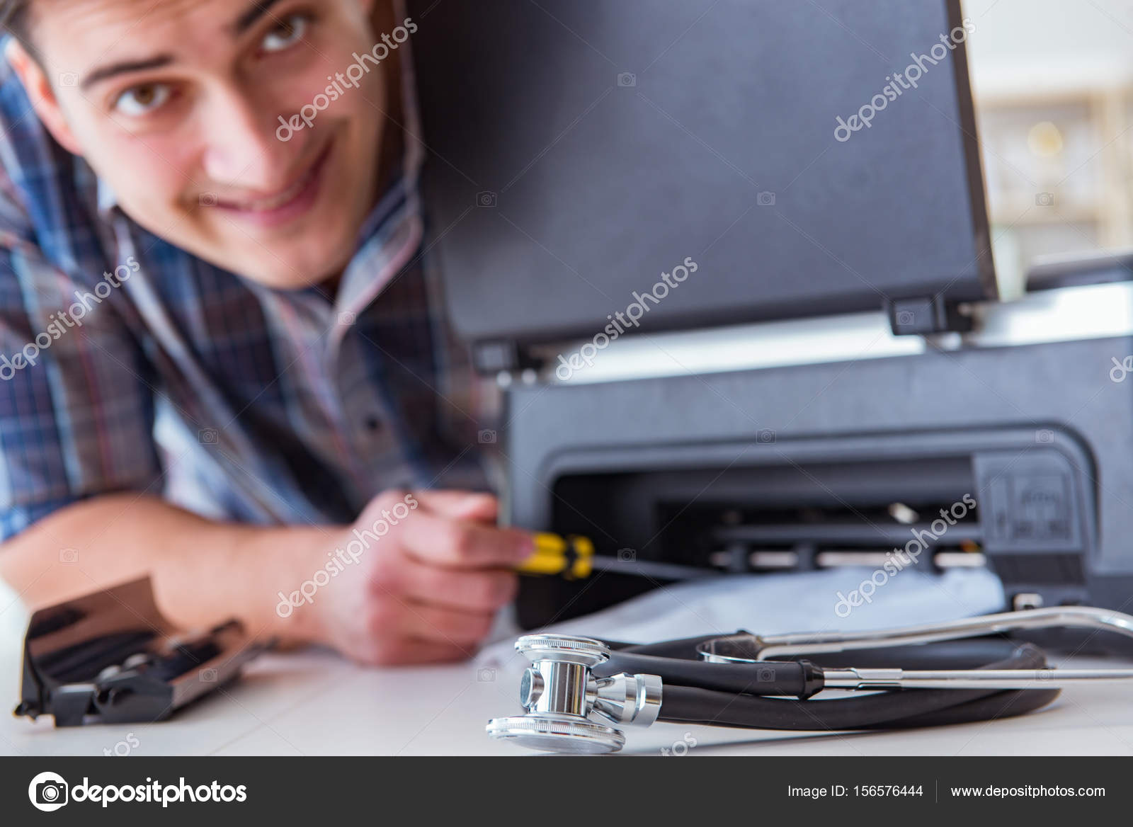 Repairman repairing broken color printer — Stock Photo © Elnur_ #156576444