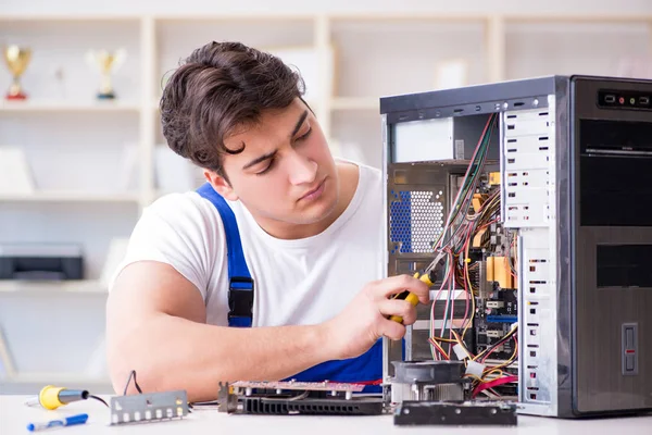 Worker fixing computer Stock Photos, Royalty Free Worker fixing ...