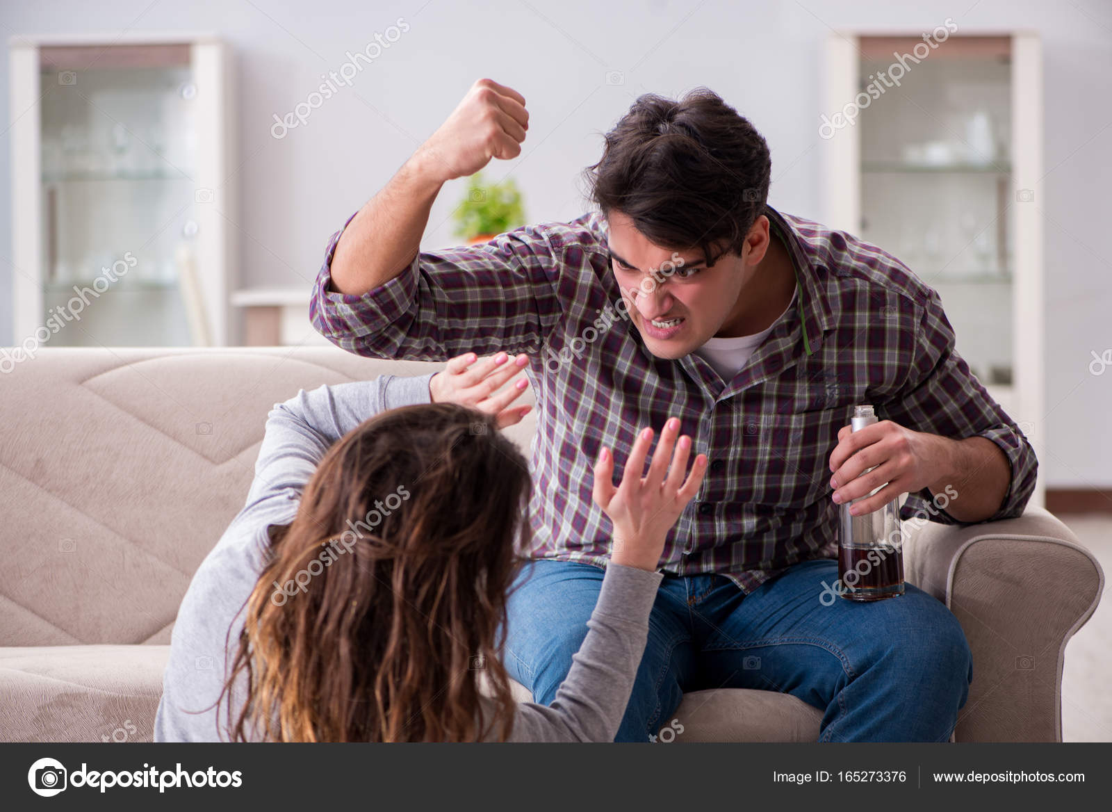 Domestic violence concept in a family argument with drunk alcoho ...
