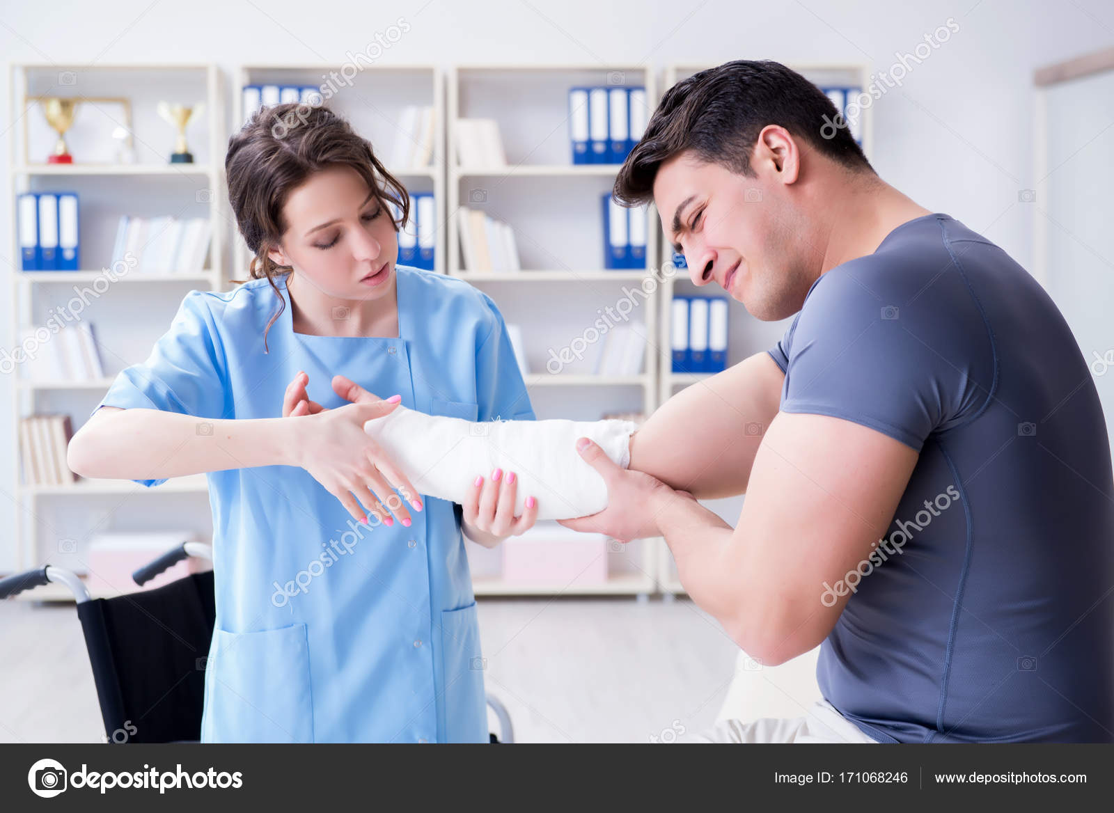 Doctor and patient during check-up for injury in hospital Stock Photo ...