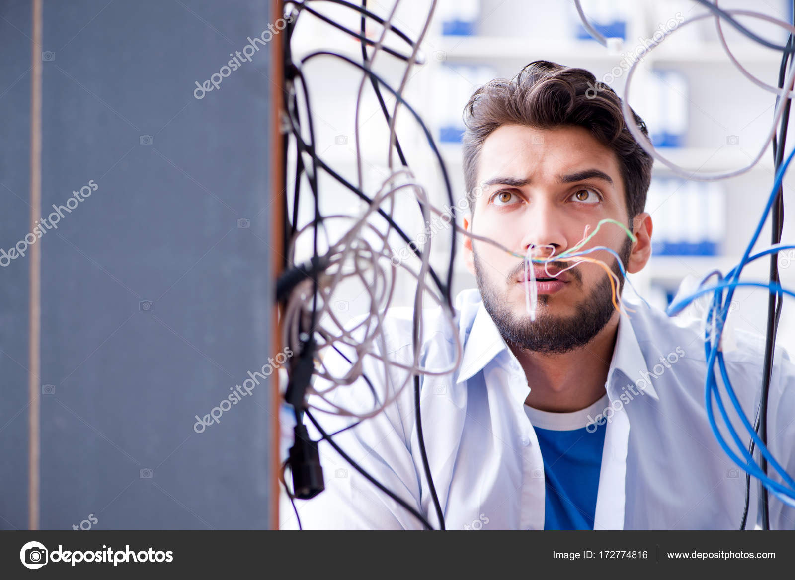Electrician trying to untangle wires in repair concept Stock Photo by ...