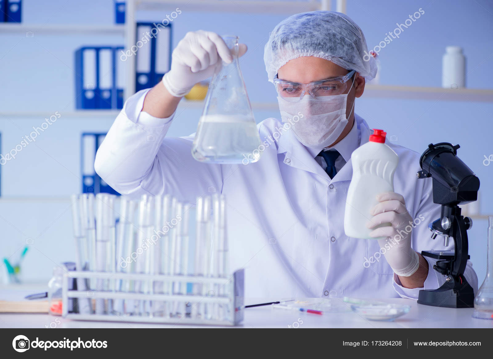 Man in the lab testing new cleaning solution detergent Stock Photo by ...