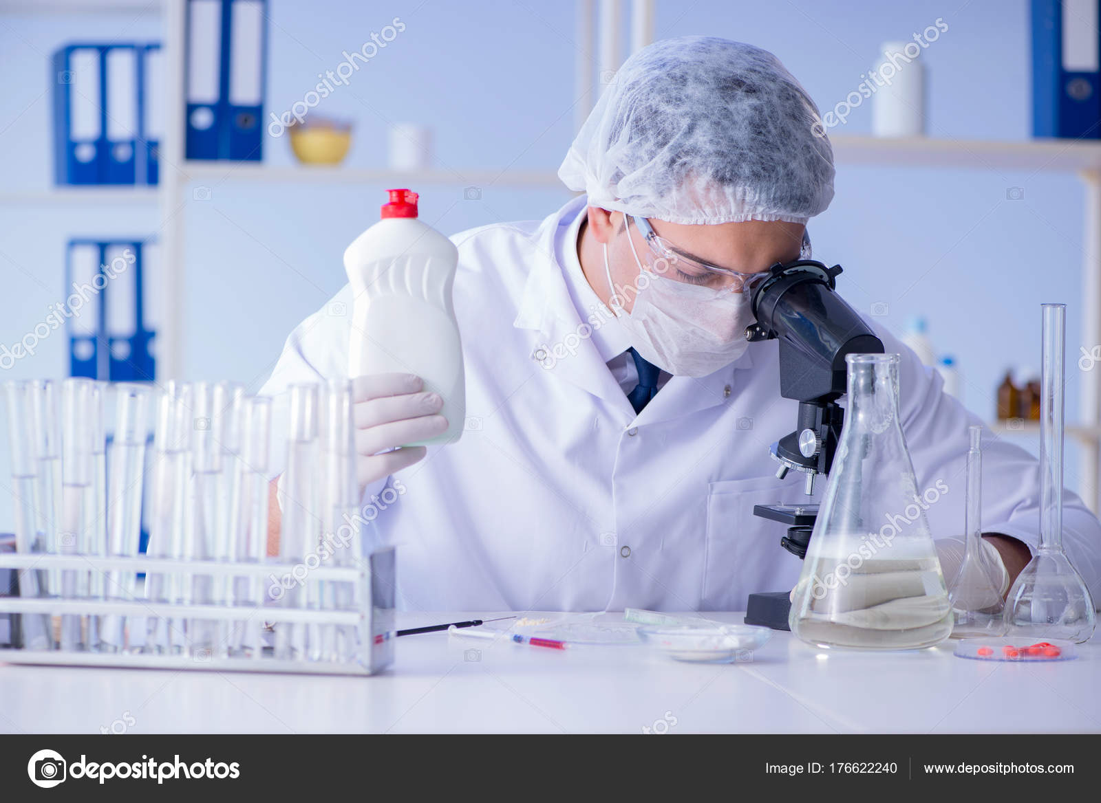 Man in the lab testing new cleaning solution detergent — Stock Photo ...