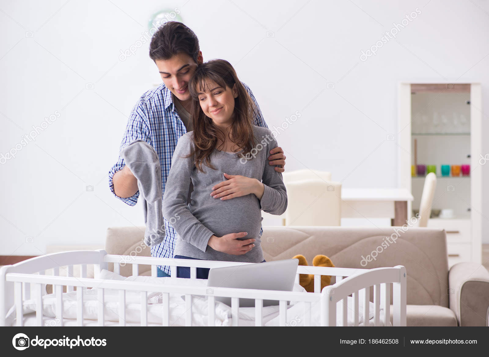 Young parents expecting their first baby — Stock Photo © Elnur_ #186462508