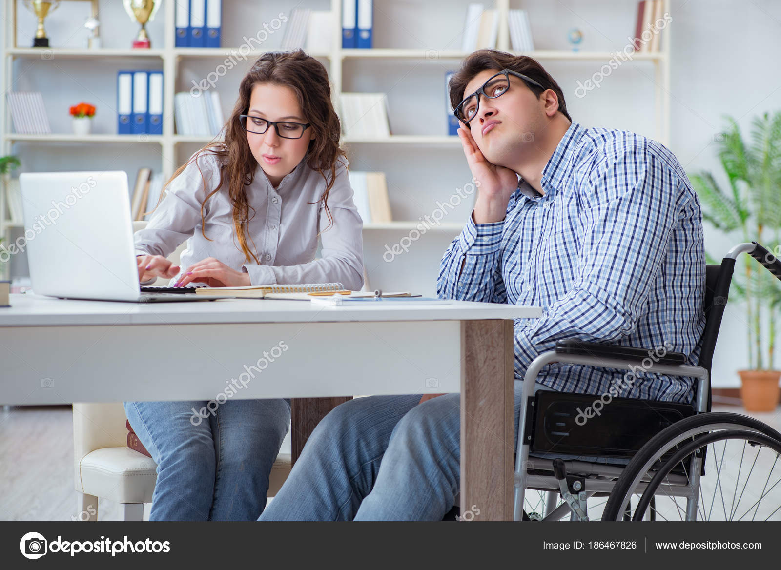 Disabled student studying and preparing for college exams Stock Photo ...