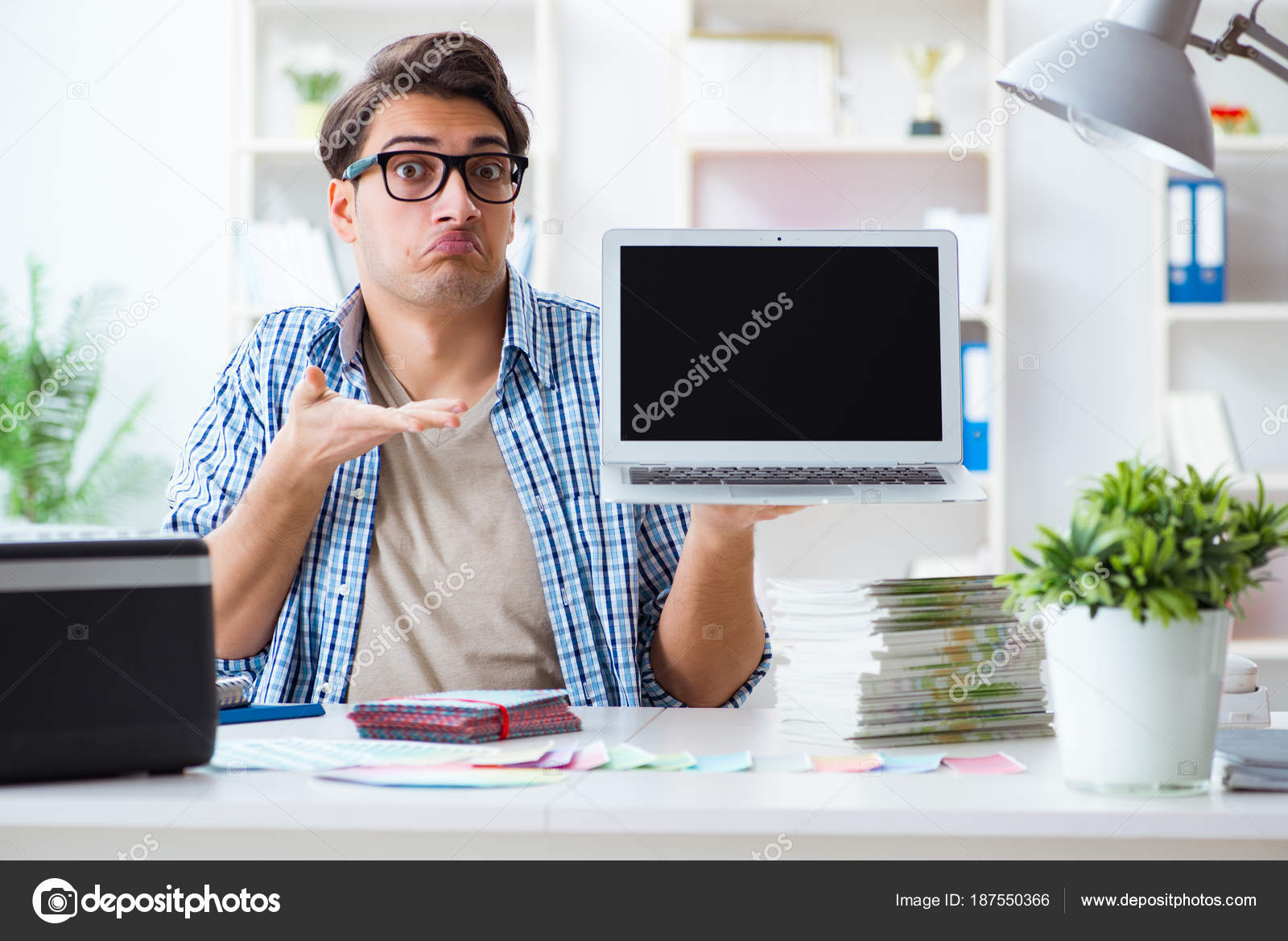Young designer showing the presentation on computer Stock Photo by ...