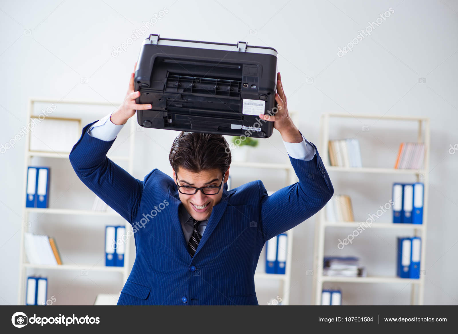 Businessman angry at copying machine jamming papers — Stock Photo ...
