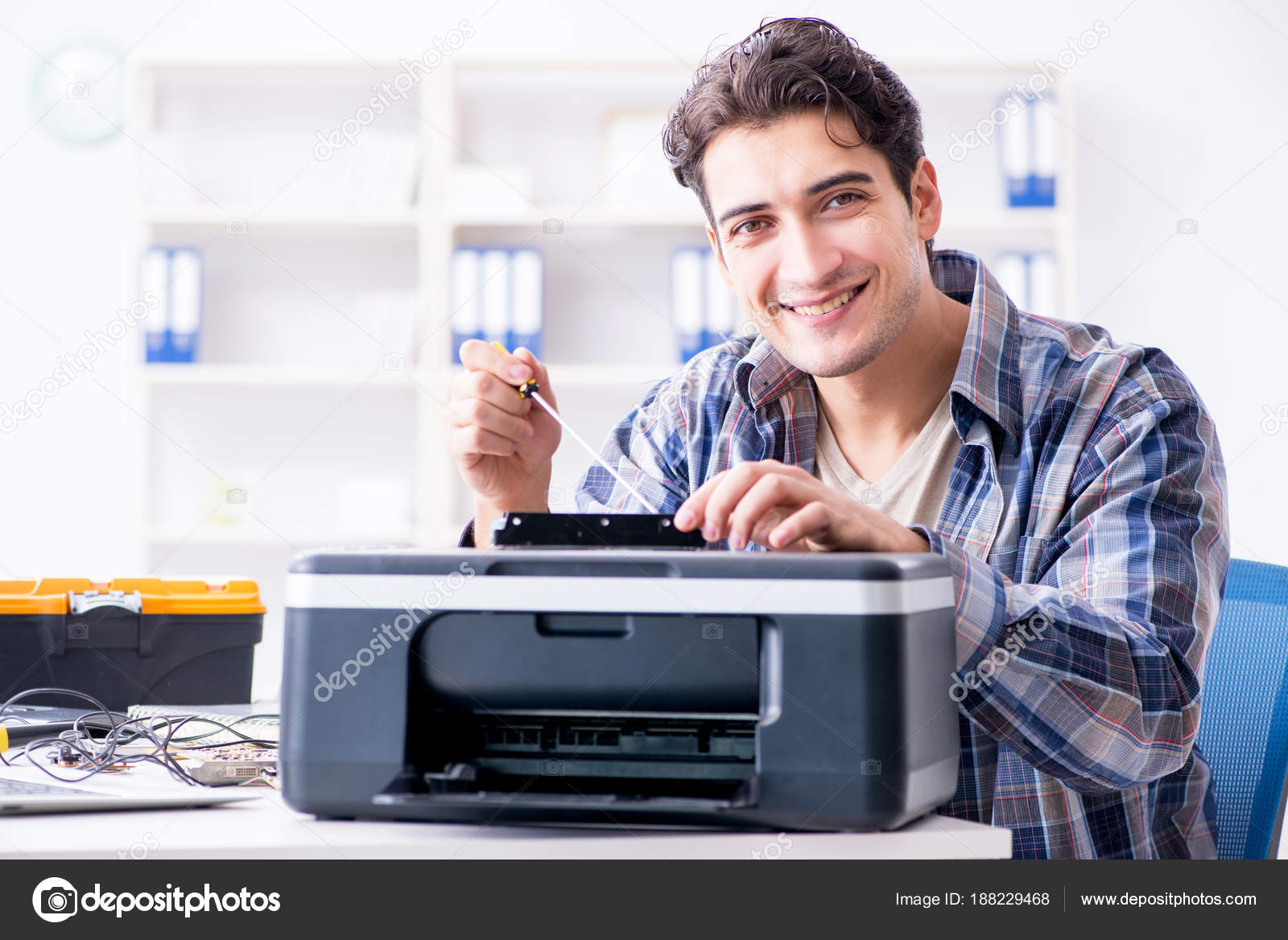 Hardware repairman repairing broken printer fax machine Stock Photo by ...