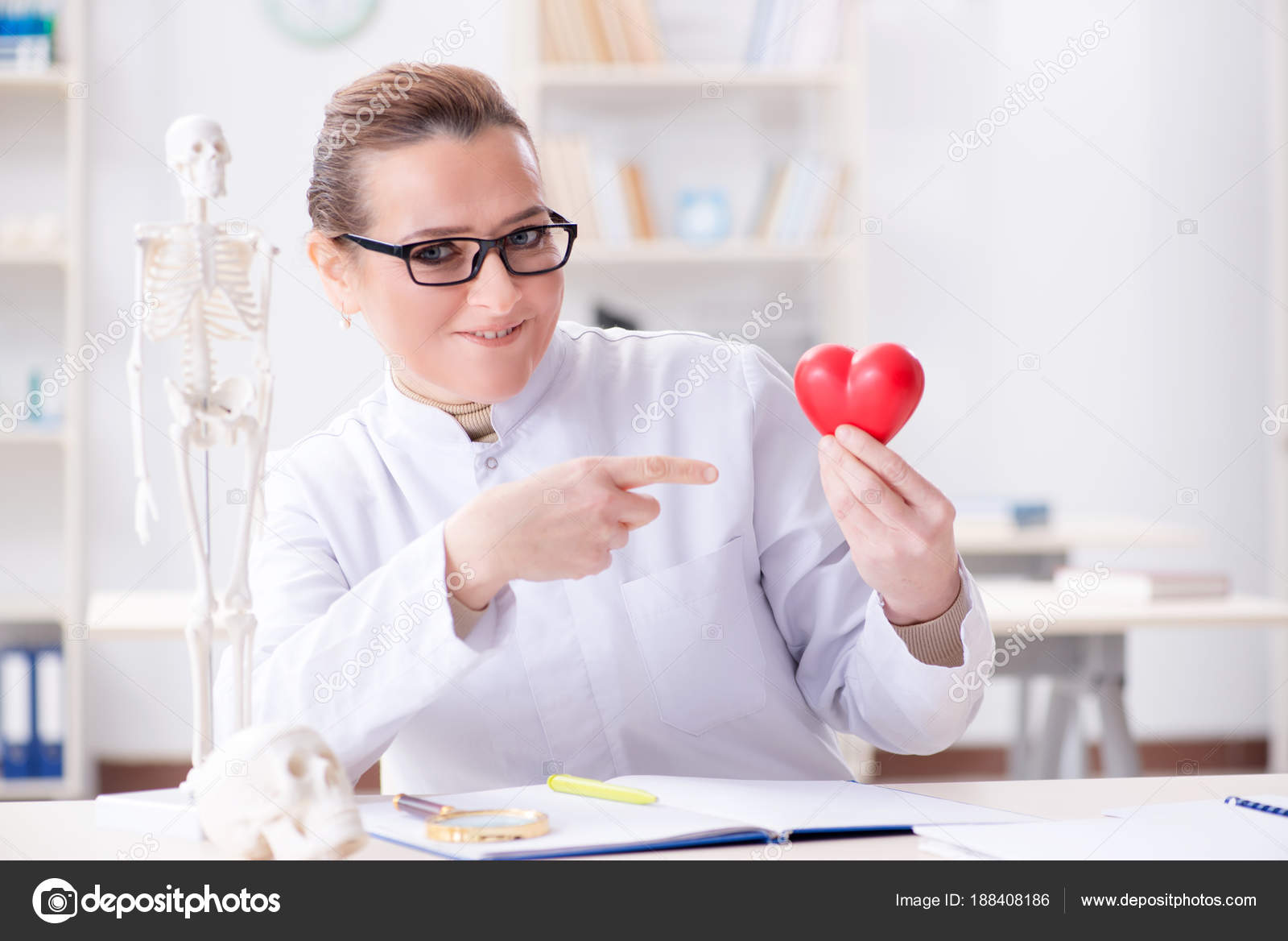 Cardiologist with red heart in medical concept Stock Photo by ©Elnur ...
