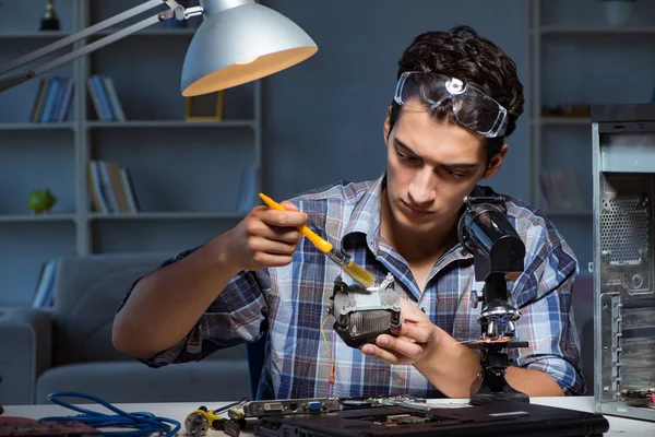 Computer repair man cleaning dust with brush - Stock Image - Everypixel