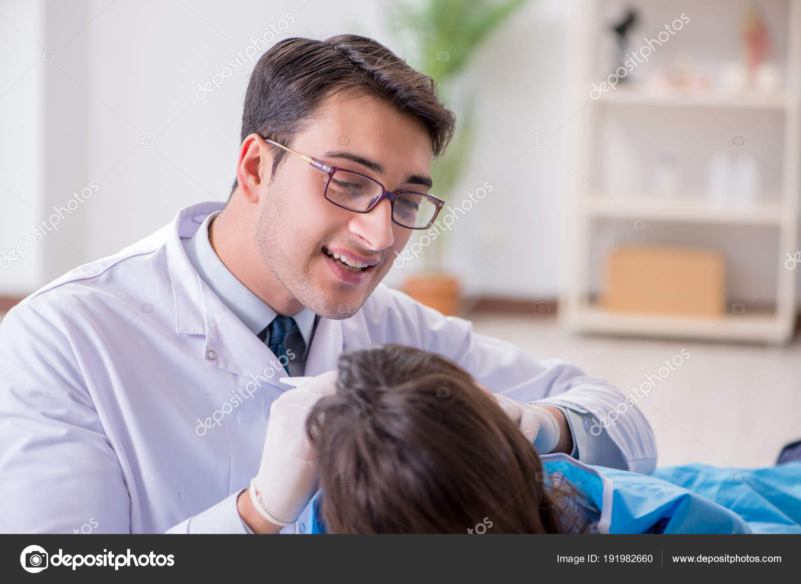 Patient visiting dentist for regular check-up and filling Stock Photo ...