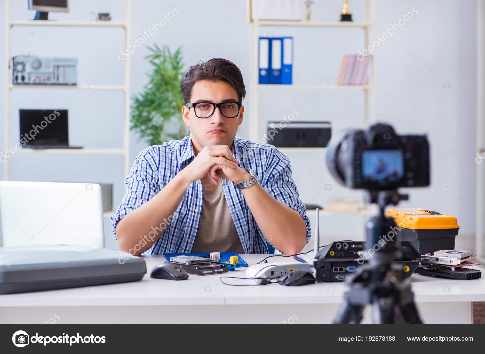 Vlogger recording computer repair on camera for vlog blog Stock Photo ...