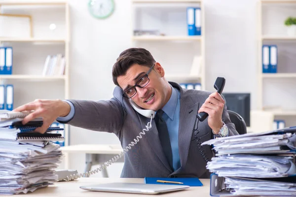 Desperate sad employee tired at his desk in call center - Stock Image ...