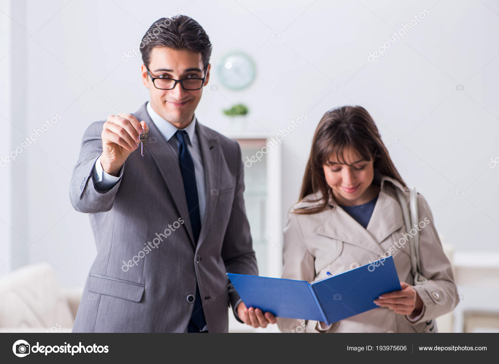 Real estate agent showing new apartment property to client — Stock ...