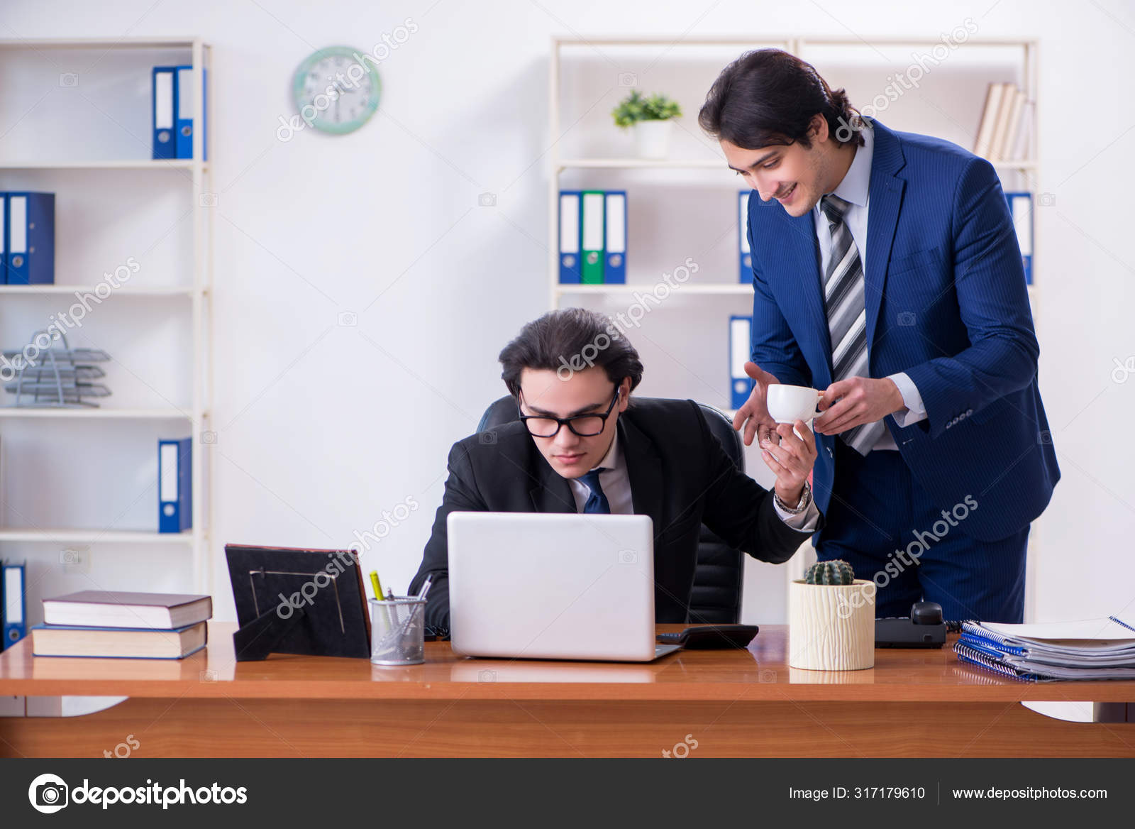 Boss and his male assistant working in the office — Stock Photo © Elnur ...