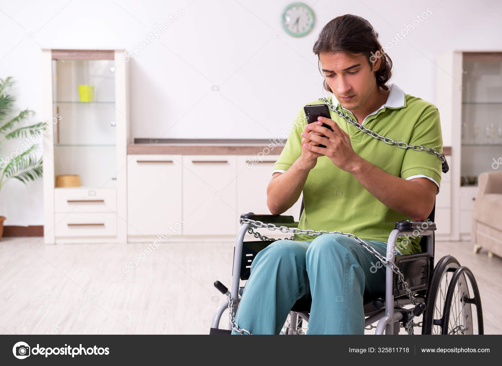 Young male invalid in wheel-chair suffering at home — Stock Photo ...