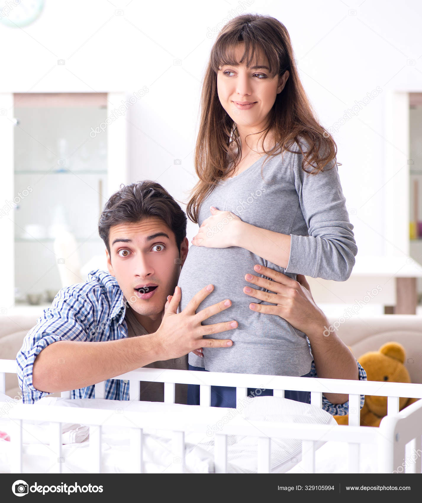 Young parents expecting their first baby — Stock Photo © Elnur_ #329105994