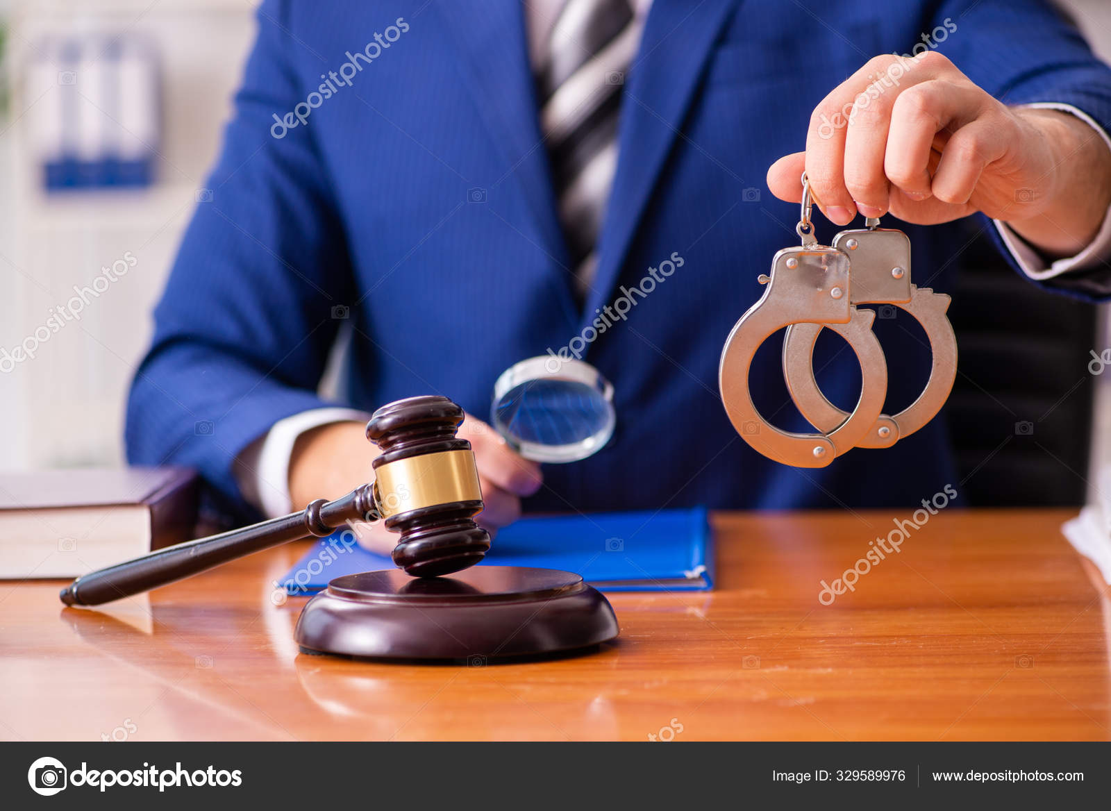 Young male judge sitting in courtroom — Stock Photo © Elnur_ #329589976