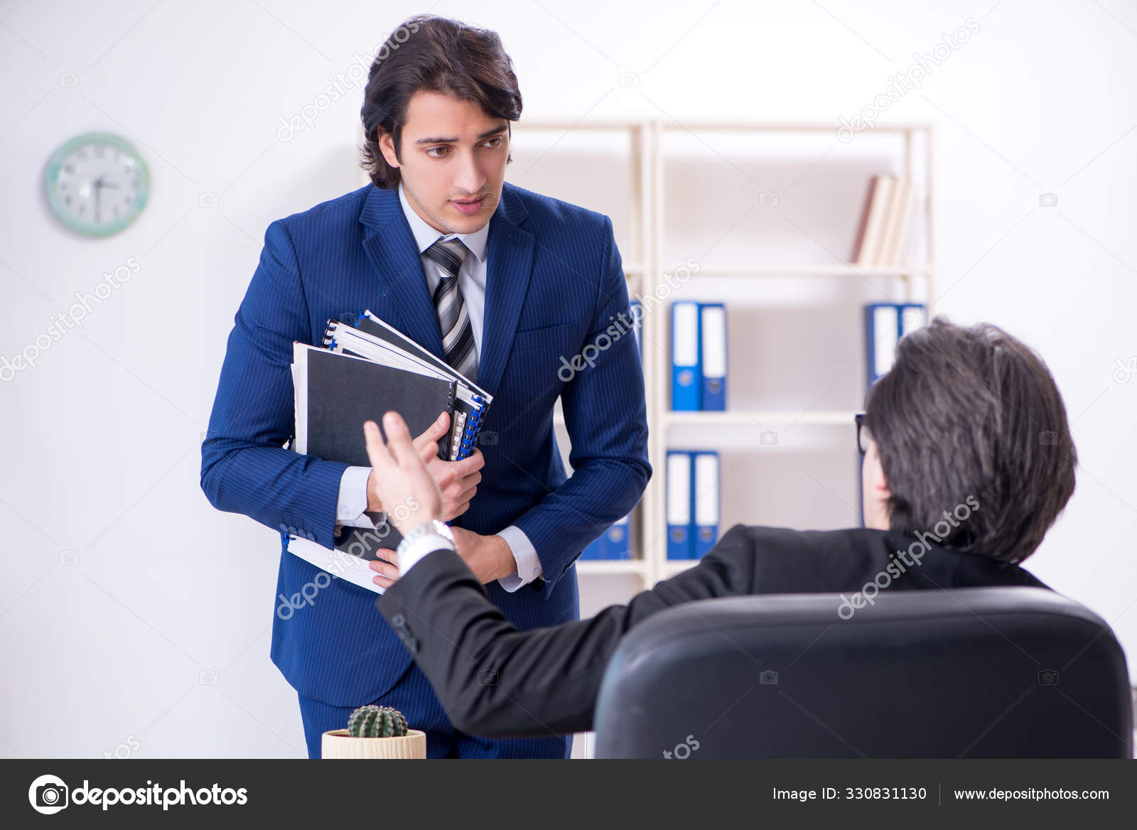Boss and his male assistant working in the office — Stock Photo © Elnur ...