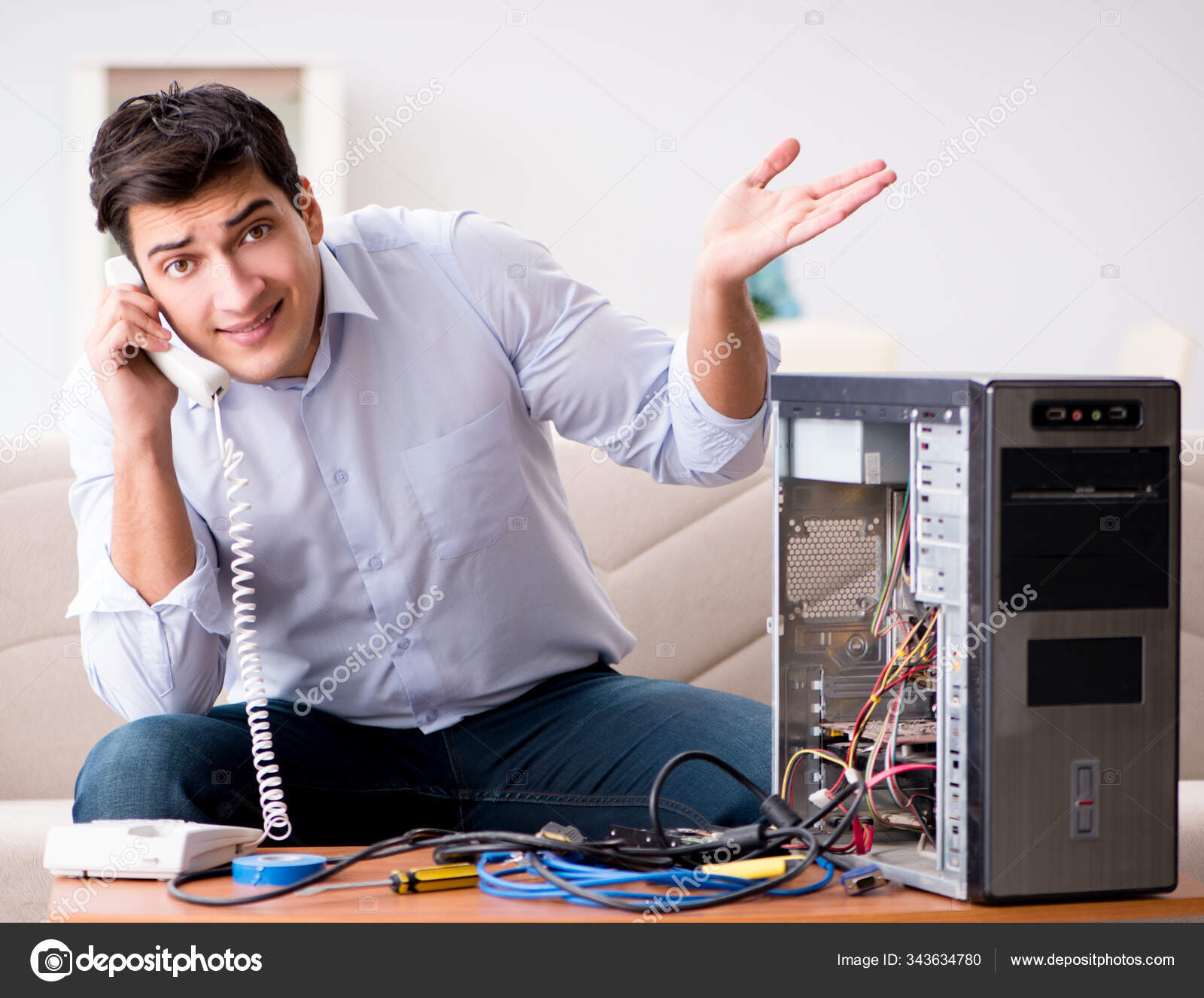 Angry customer trying to repair computer with phone support Stock Photo ...