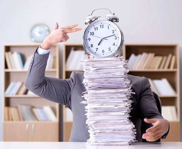 Businessman struggling to meet challenging deadlines - Stock Image ...
