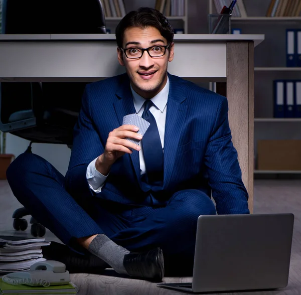 Businessman working overtime long hours late in office - Stock Image ...