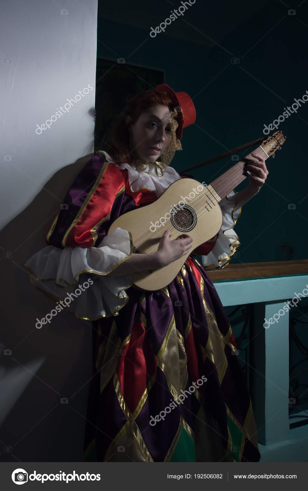 Colombina plays vihuela Stock Photo by ©Demian 192506082