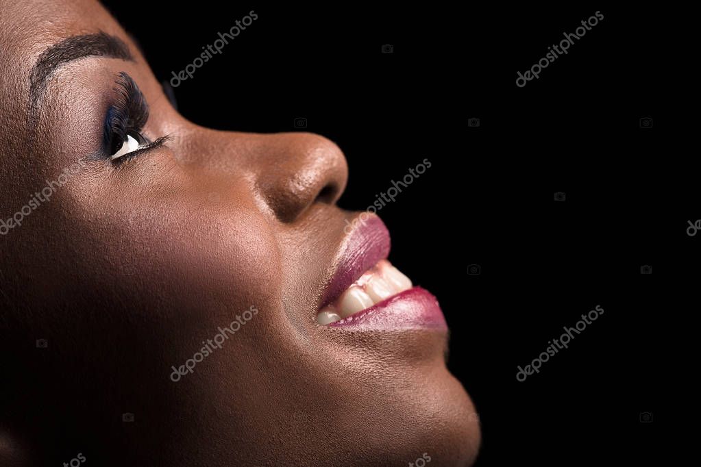 Side view portrait of dark skinned model on a black background. — Stock ...