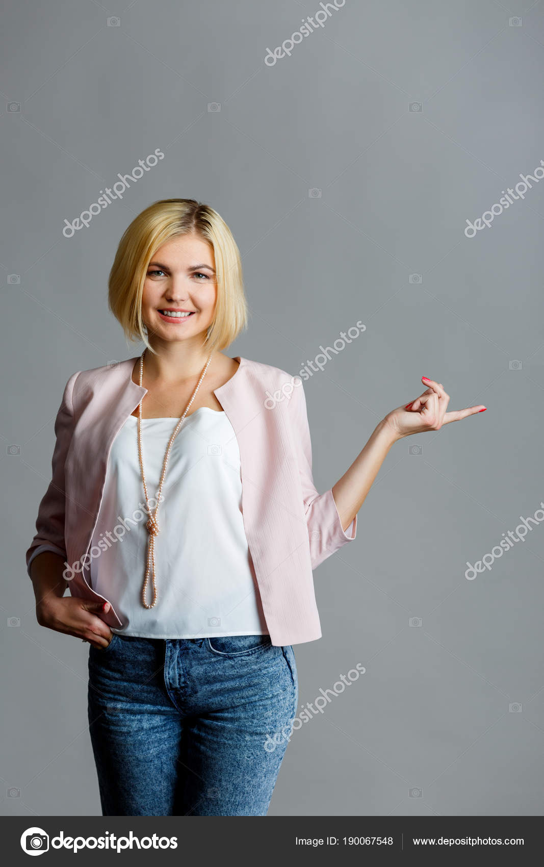 Blonde pointing at empty space Stock Photo by ©logoff 190067548