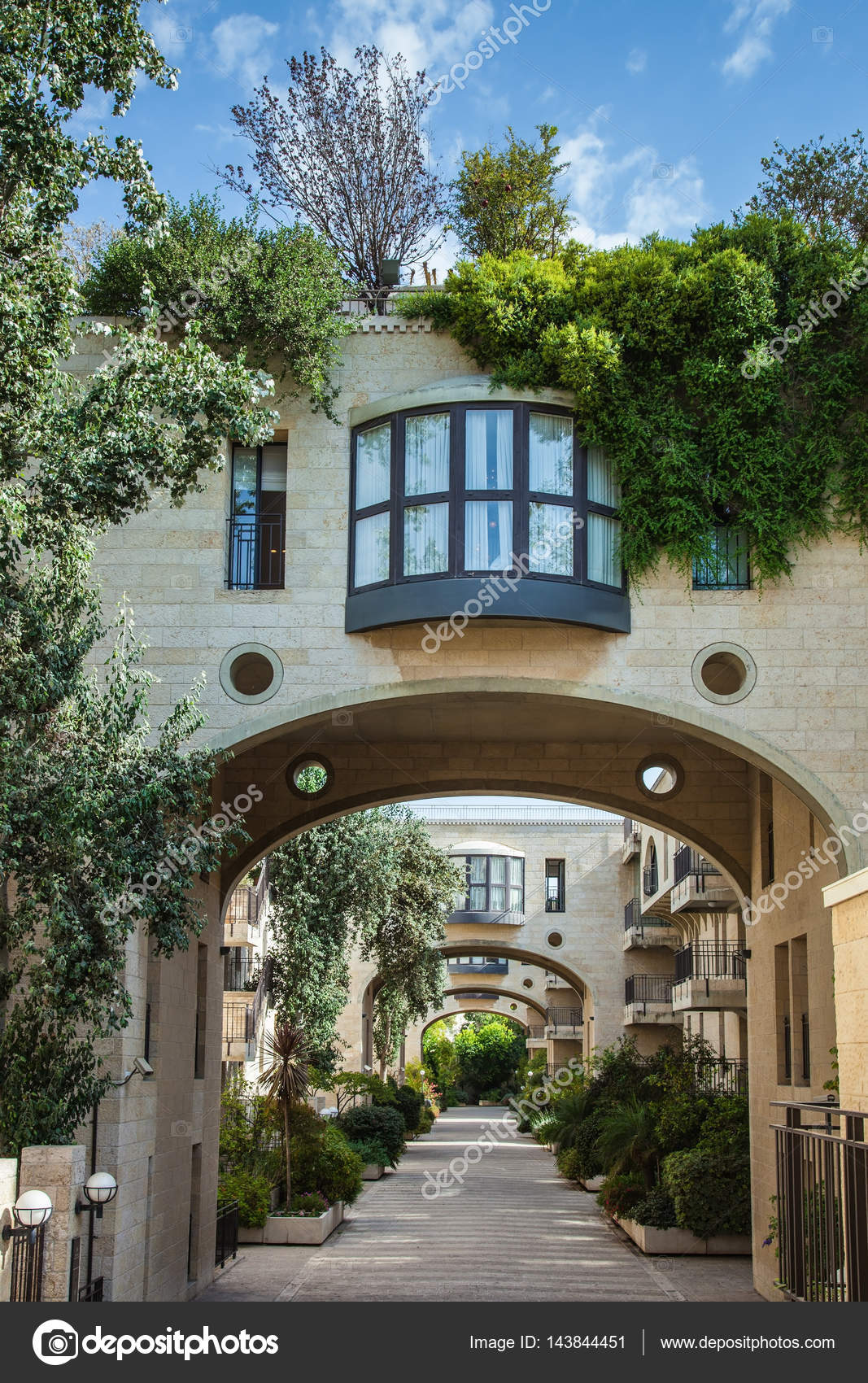 Arched passageway between buildings Stock Photo by ©kavramm 143844451