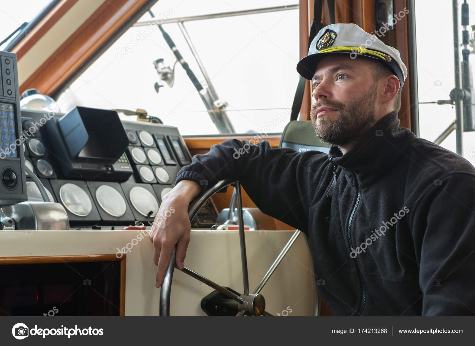 Captain at the helm of boat going along the Pacific Ocean — Stock Photo ...