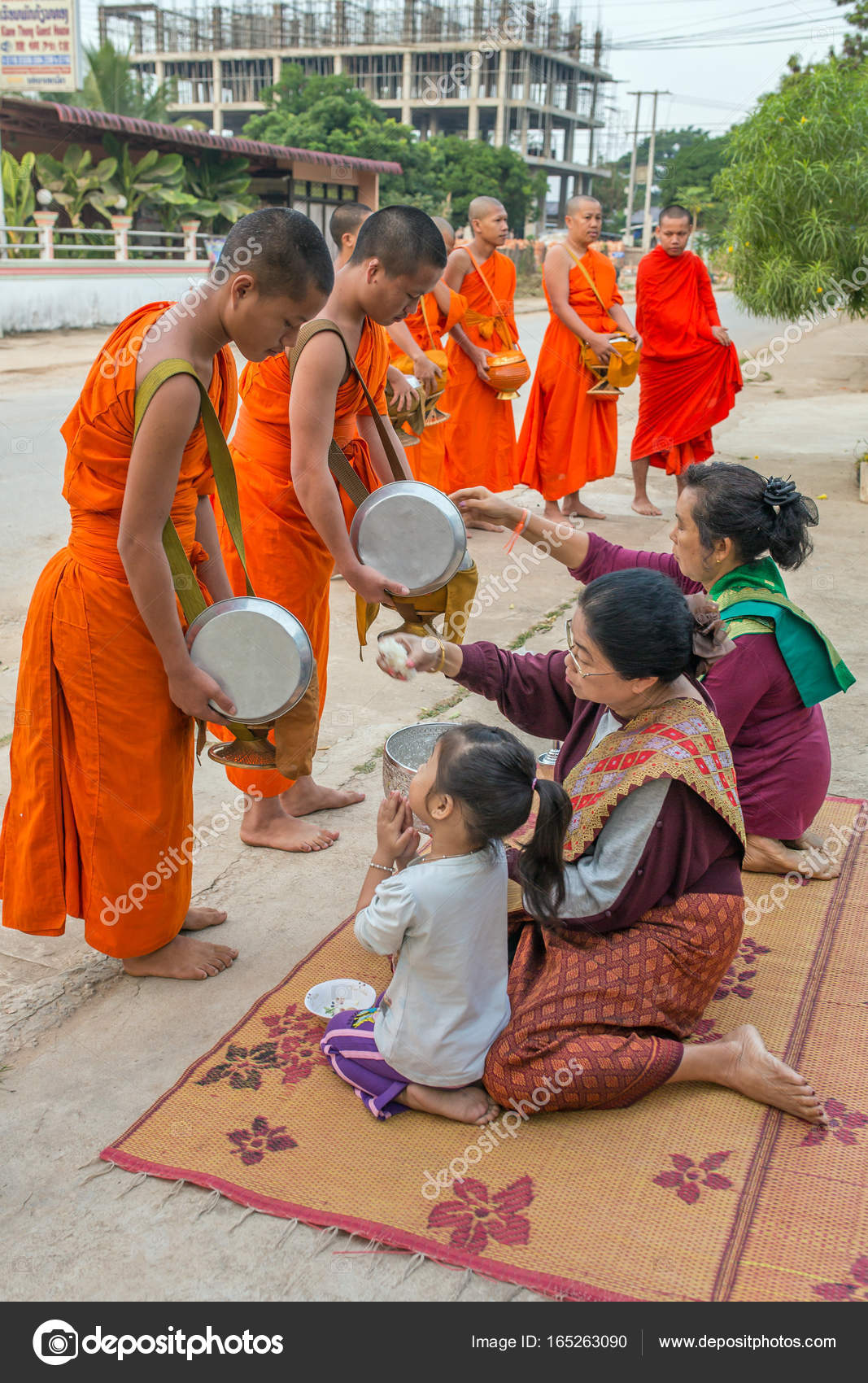 Buddhist monks collecting alms – Stock Editorial Photo © mazzzur #165263090