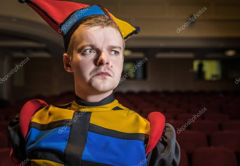 Actor dressed jester's costume in interior of old theater. — Stock ...