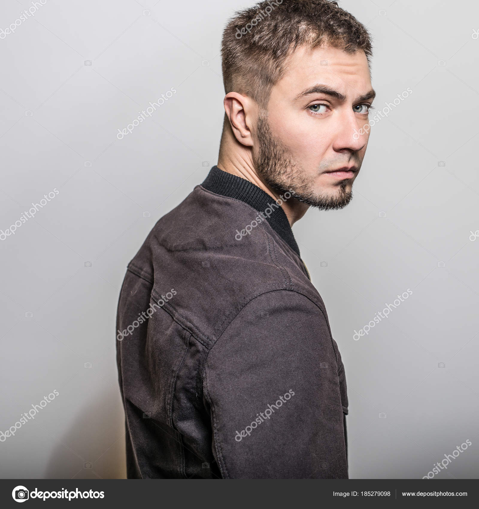 Handsome man pose in studio. Stock Photo by ©innervision 185279098