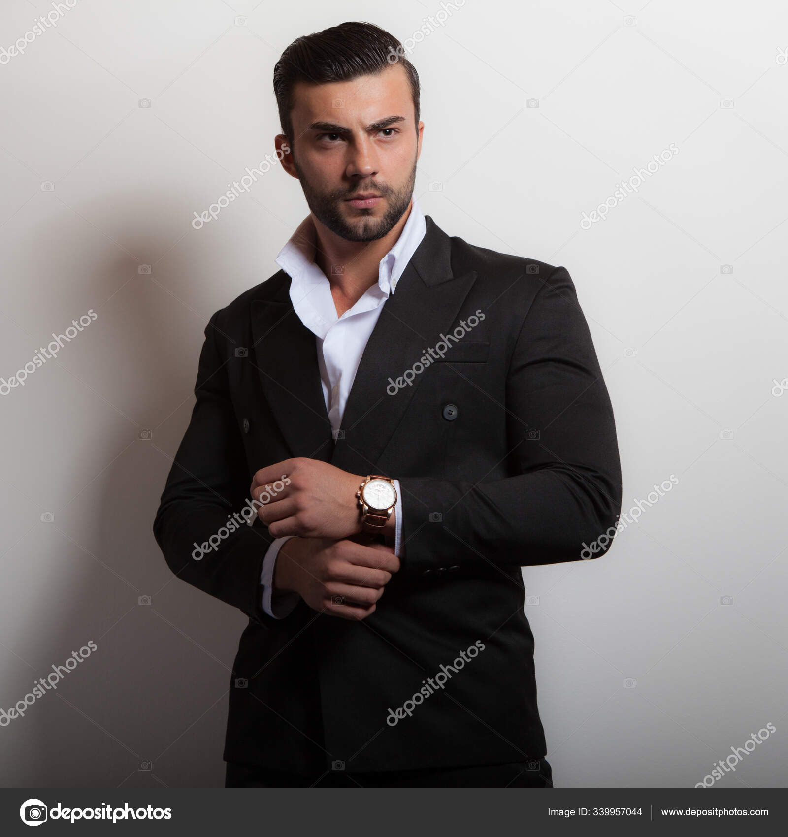 Handsome young elegant man studio portrait. Stock Photo by ©innervision ...