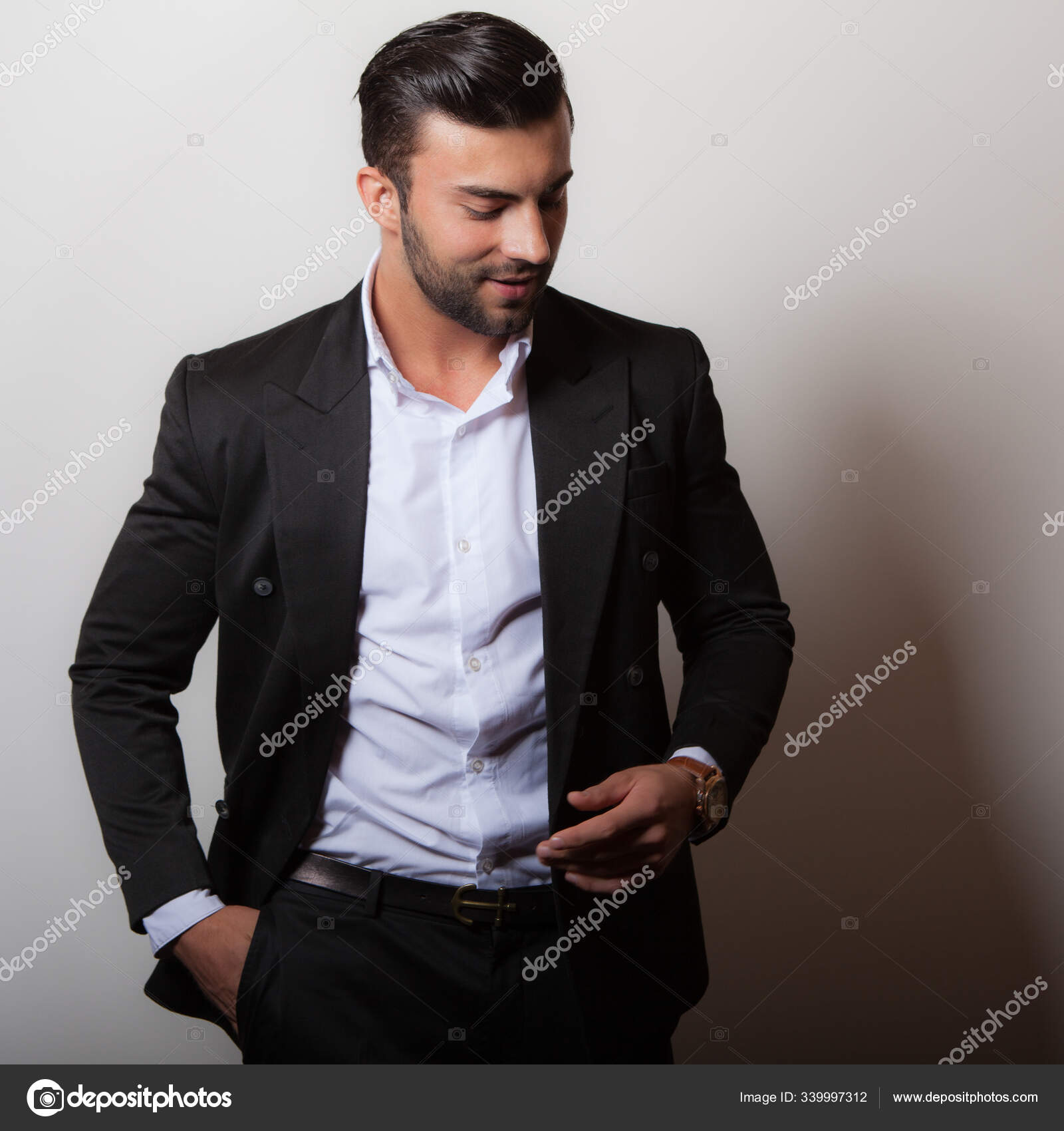 Handsome young elegant man studio portrait. Stock Photo by ©innervision ...